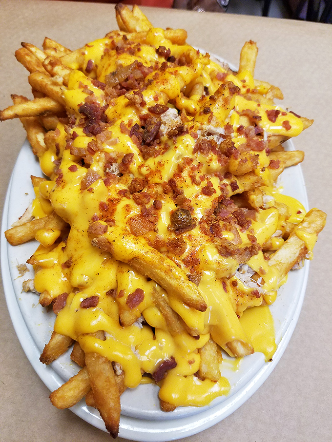 Crab fries: Where French fries meet melted cheese and bacon, creating a carb-loaded masterpiece that's worth every delicious calorie.