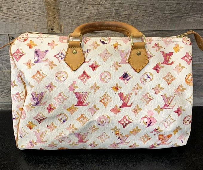 This Louis Vuitton watercolor speedy bag isn't just an accessory—it's wearable art that once cost someone a month's rent, now available for a fraction.