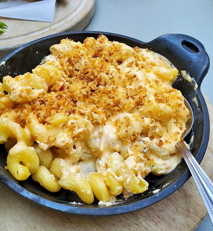 Mac & cheese that doesn't whisper comfort—it belts it out like Aretha Franklin with a crispy breadcrumb topping serving as backup singers.