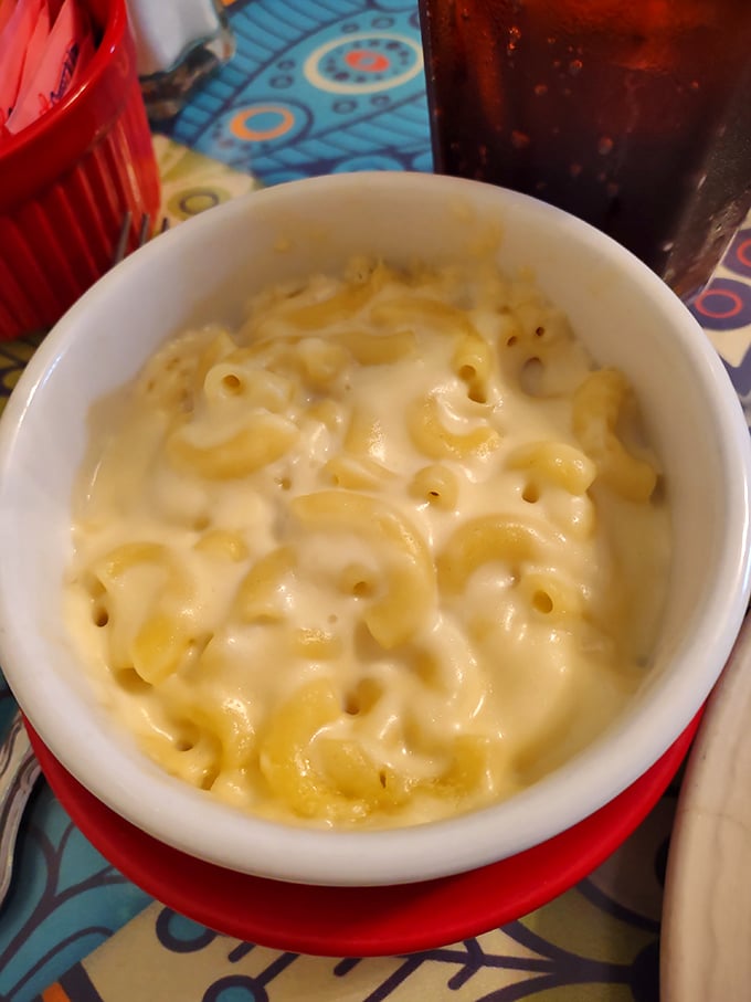 Mac and cheese that achieves the impossible—each elbow pasta perfectly coated in creamy, cheesy goodness that clings just right to your fork.