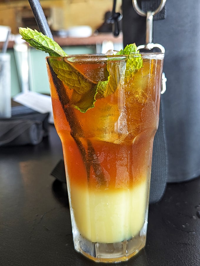 The Mai Tai arrives in layers like a California sunset, promising tropical escape with each sip—no passport or sunscreen required.