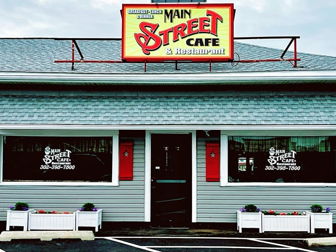 Main Street Cafe's vibrant sign promises breakfast and lunch worth writing home about—if you weren't already planning to move here after one visit.