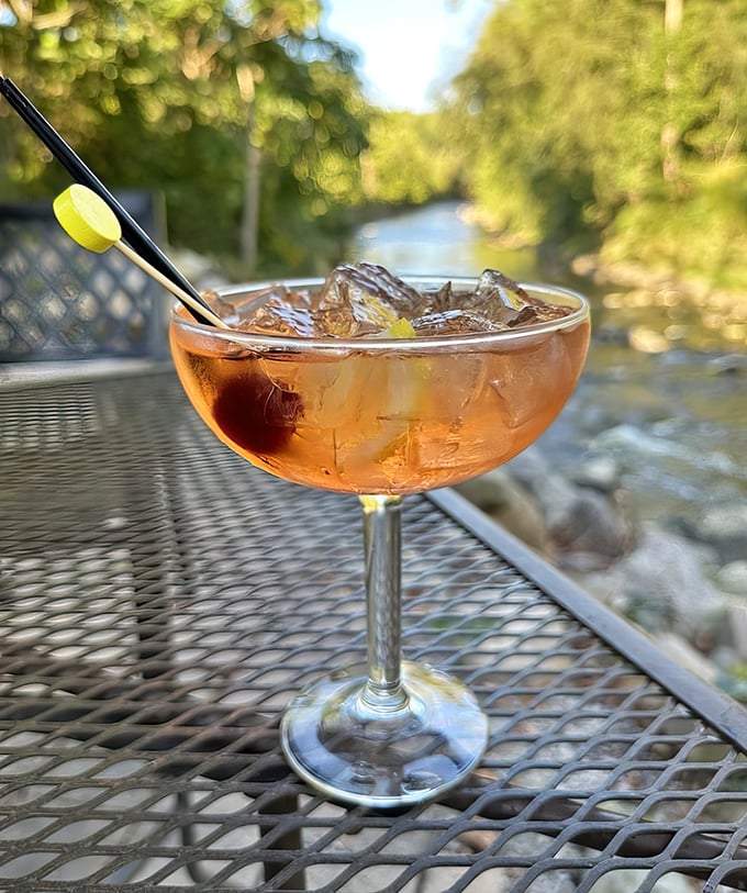A cocktail with a view – this Manhattan looks even better against the backdrop of the actual creek that gives the tavern its name.