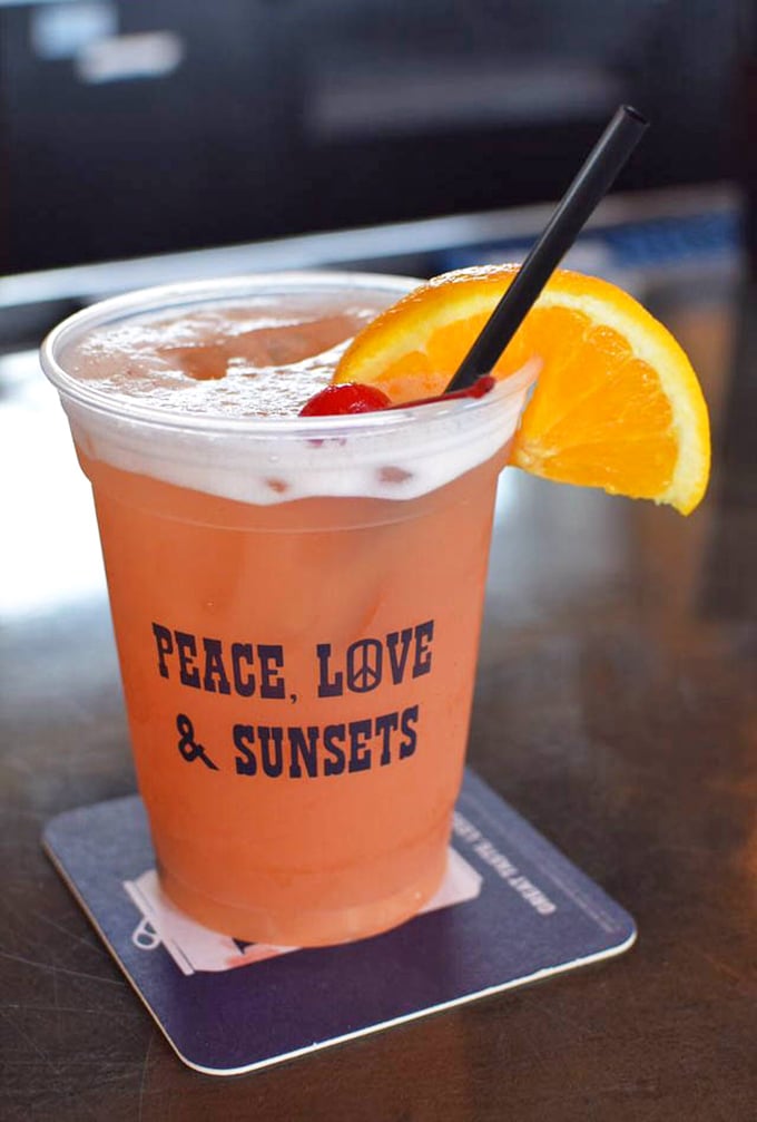 This cocktail doesn't just promise peace, love, and sunsets – it delivers them with every sip.