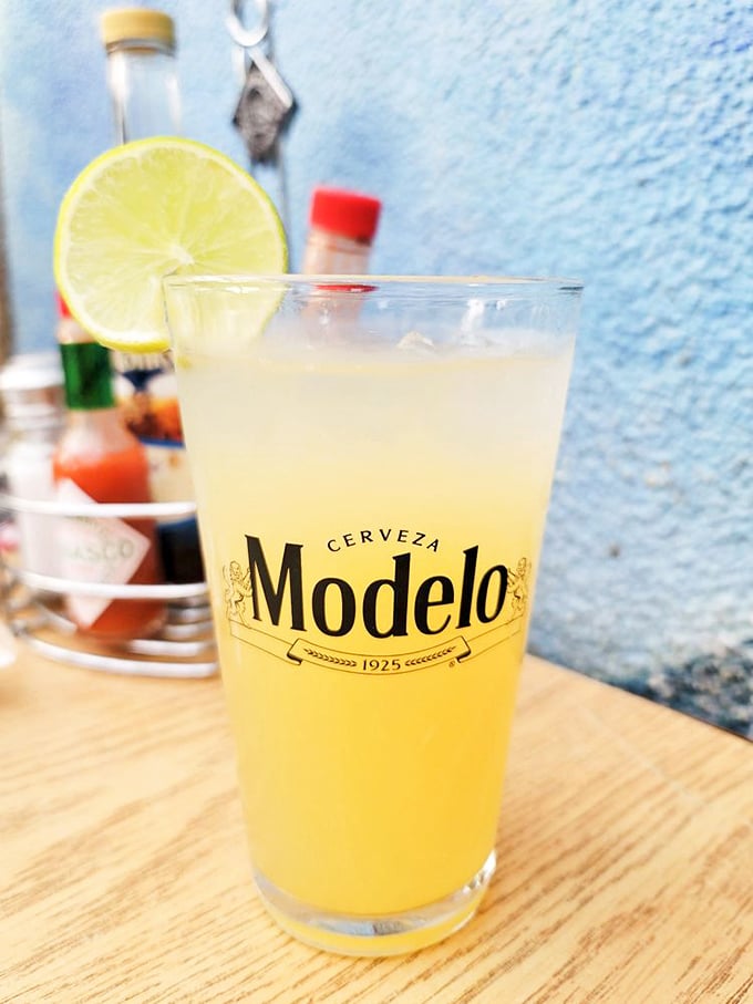 Nothing complements seafood like a cold Modelo with lime. This golden elixir is the perfect partner for your maritime feast.