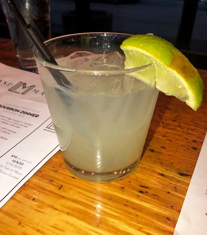 A proper margarita with a fat lime wedge—because sometimes you need something tart and refreshing to cut through all that smoky richness.