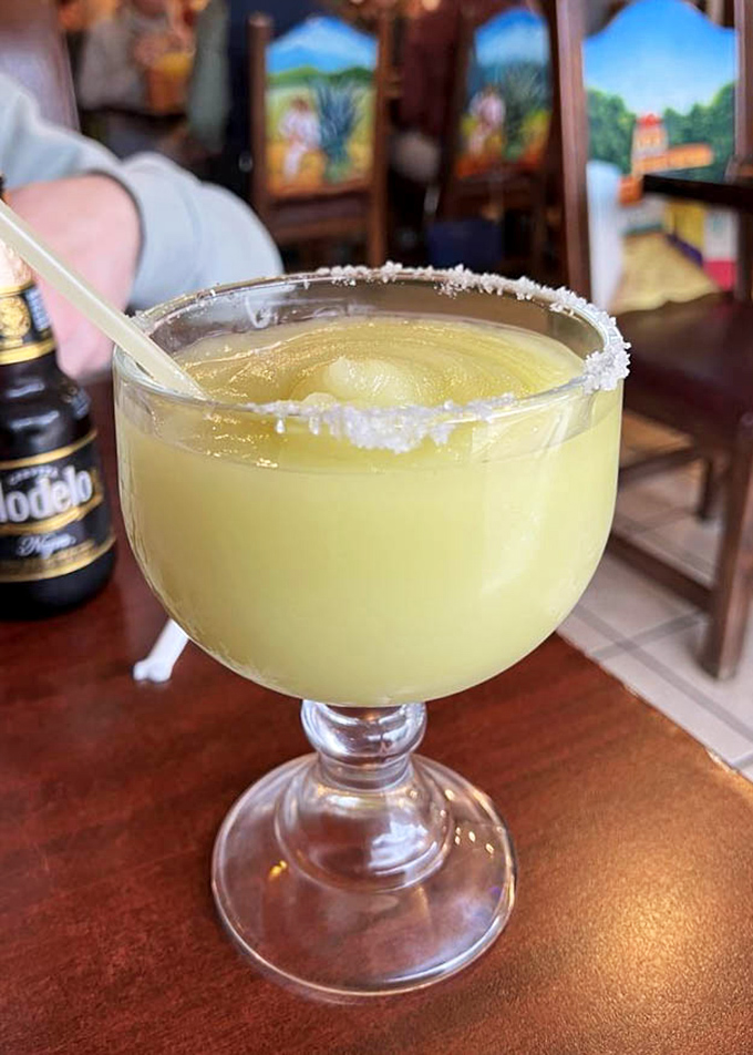 A margarita so perfectly golden it deserves its own trophy case—salt-rimmed and ready to transform your Tuesday into a celebration.
