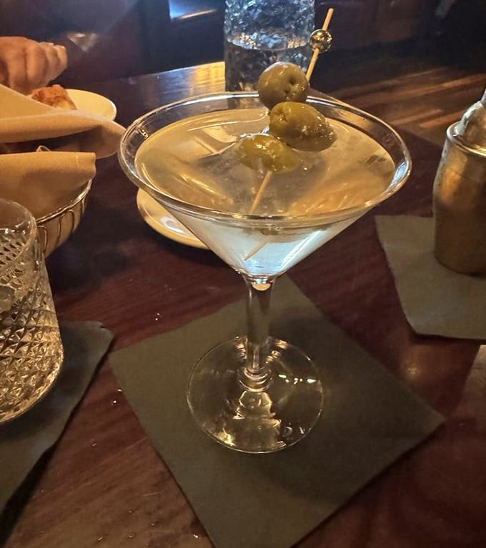 A martini so classic it should come with its own jazz soundtrack. Three olives—because good things come in threes.