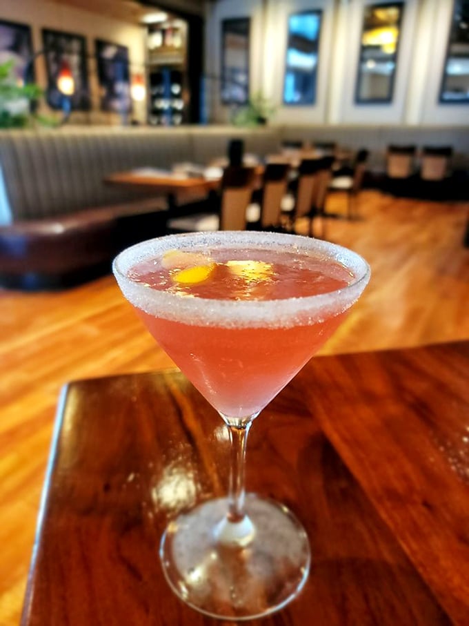 A sugar-rimmed martini catching the light just right – because sometimes the perfect cocktail is its own kind of appetizer.