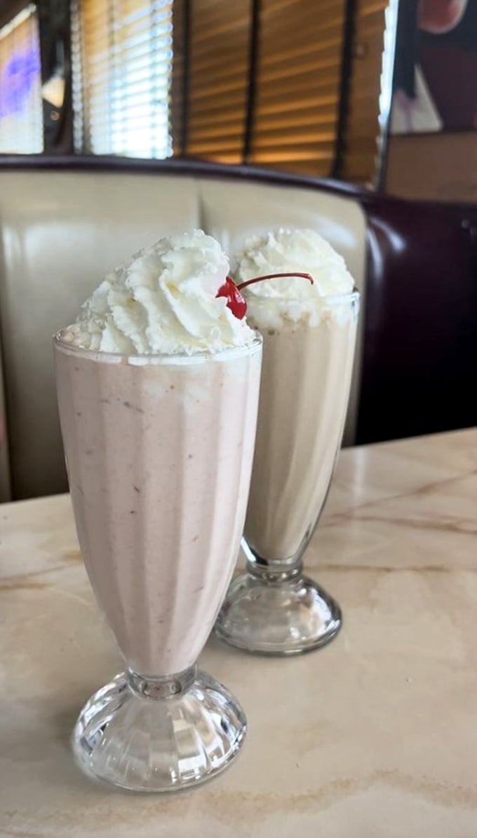 Milkshakes served in glasses tall enough to require their own zip code—complete with the mandatory cherry that makes it "healthy."