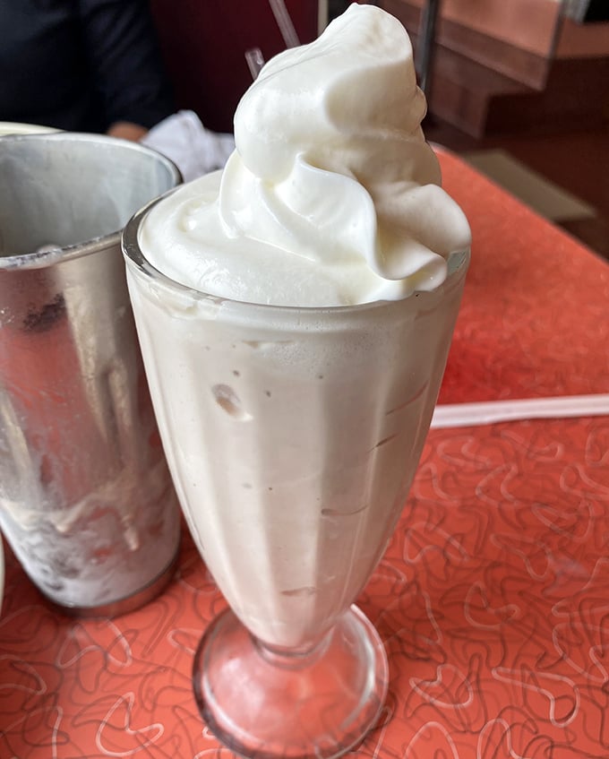 This isn't just a milkshake—it's a frothy tower of vanilla bliss that makes you wonder why we ever invented fancy desserts in the first place.