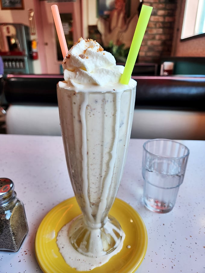 This isn't just a milkshake—it's architecture with a straw, topped with enough whipped cream to make your inner child high-five your adult self.