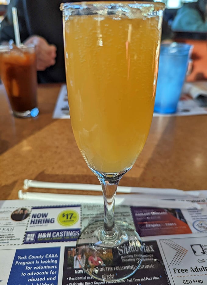A mimosa that sparkles with possibility—because sometimes breakfast deserves a little celebration, especially when you're not the one doing dishes.