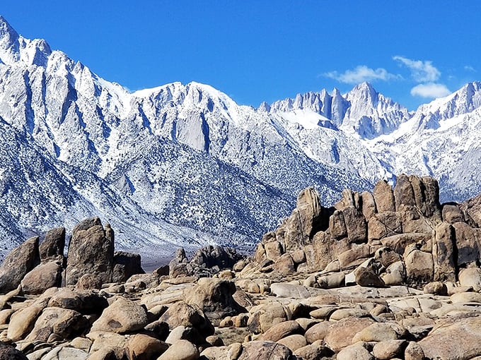 The perfect marriage of desert and alpine landscapes—where snow-dusted peaks rise dramatically above sun-baked boulders.