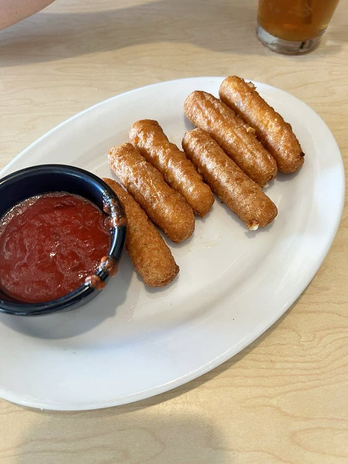 Mozzarella sticks that achieve the perfect cheese-pull-to-crunch ratio—the kind that make you forget you're technically just eating fried cheese.