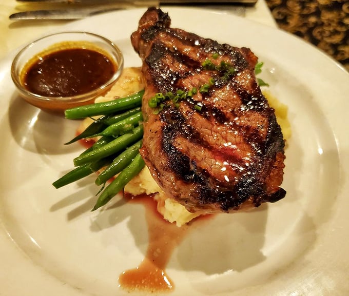 A NY strip that would make Manhattan jealous, resting on a cloud of mashed potatoes with asparagus standing at attention.