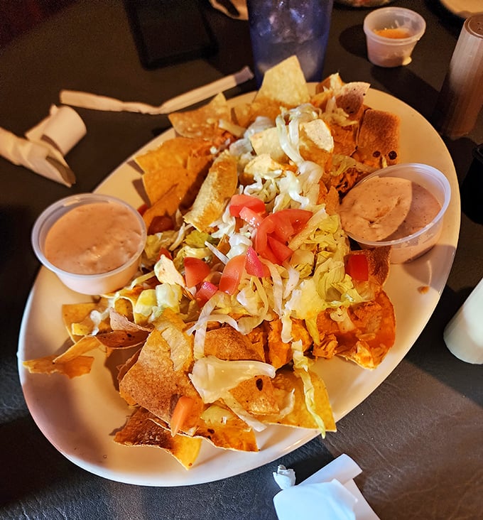 These loaded nachos could feed a small village while providing enough cheese pulls for endless social media posts.