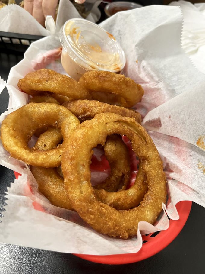 Golden rings of happiness that crunch louder than your neighbor's leaf blower. These onion rings are what fast food chains wish theirs could be.