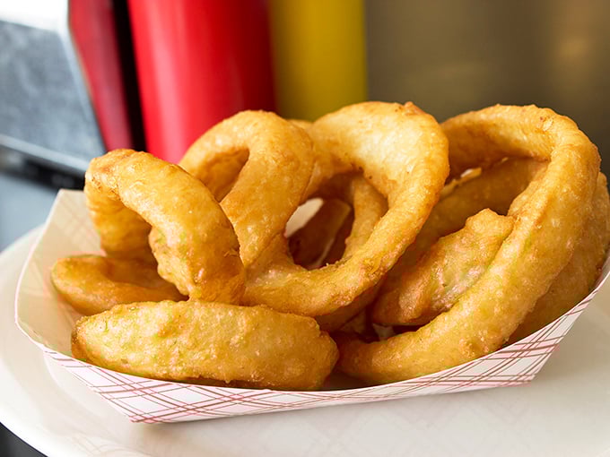 Onion rings with that perfect crunch-to-tenderness ratio—the supporting actor that sometimes steals the show from the burger headliners.