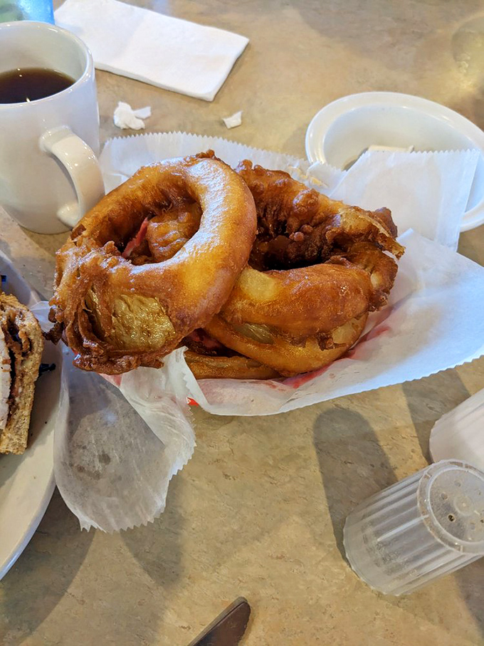 Golden, crispy onion rings that crackle with each bite. These aren't just side dishes—they're the supporting actors that steal the show.