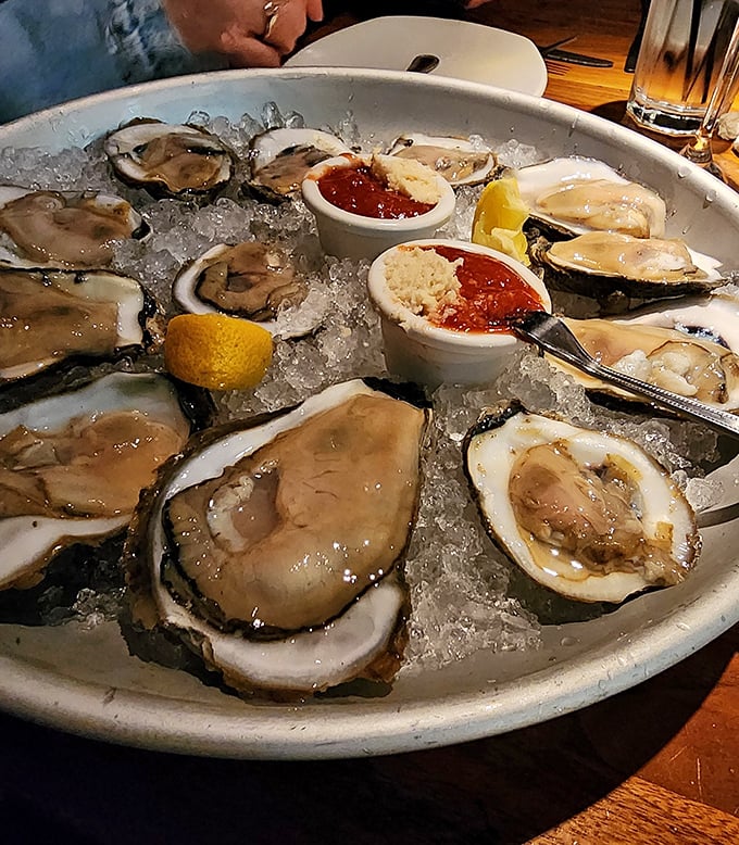 Oysters on the half shell—nature's perfect appetizer. Briny, fresh, and served with just enough accompaniments to enhance without overwhelming.
