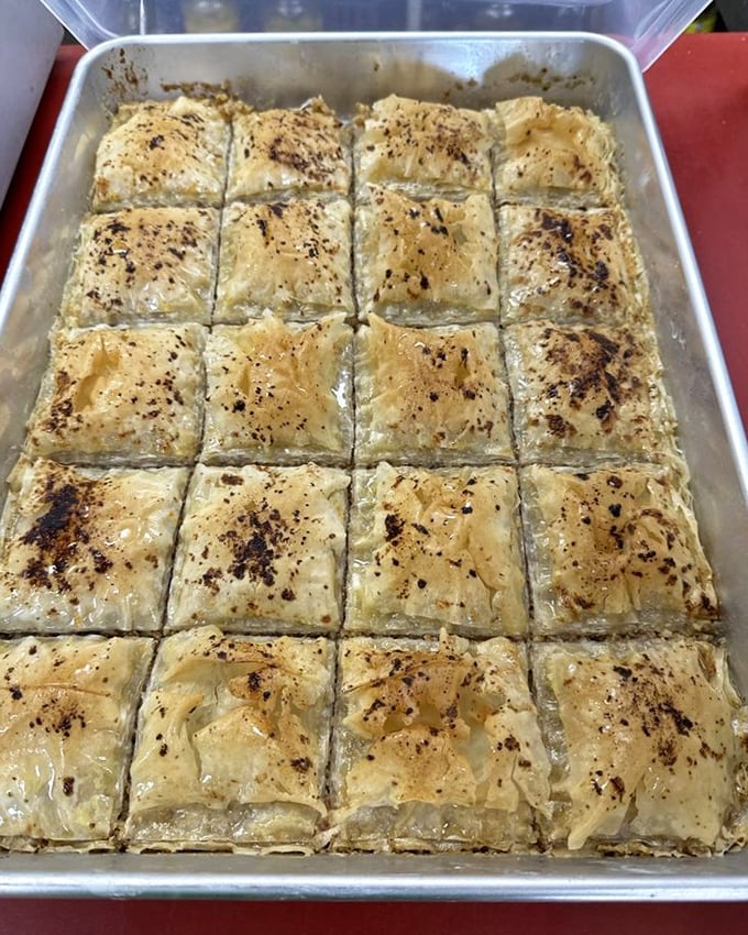 Baklava's Eastern European cousin—layers of flaky pastry that shatter delicately with each bite. The geometric precision here is only outdone by the flavor.