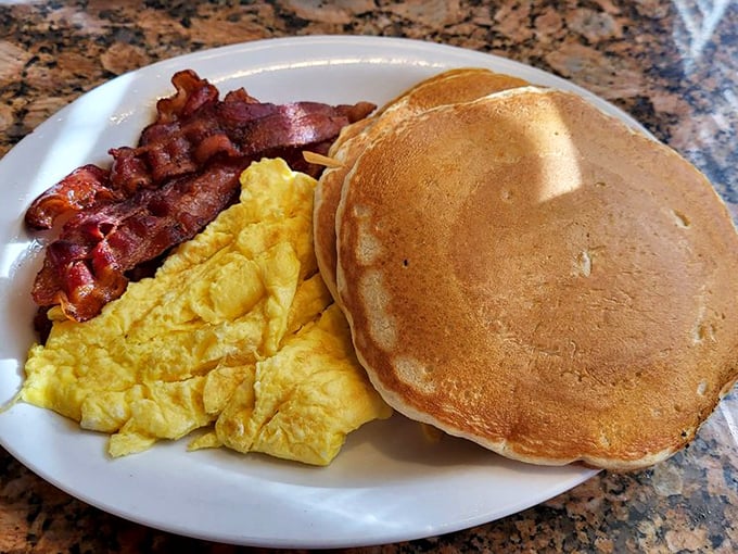 Pancakes, eggs, and bacon: the holy trinity of breakfast foods, executed with the precision of a NASA launch but with much tastier results.