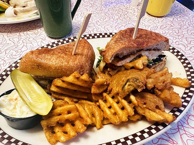 This sandwich isn't messing around—crispy bread, savory fillings, and those waffle fries deserve their own Connecticut postal code.