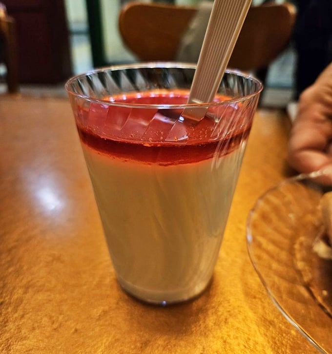 This layered panna cotta with its ruby-red topping isn't just dessert—it's the sweet finale your taste buds have been patiently waiting for all meal.