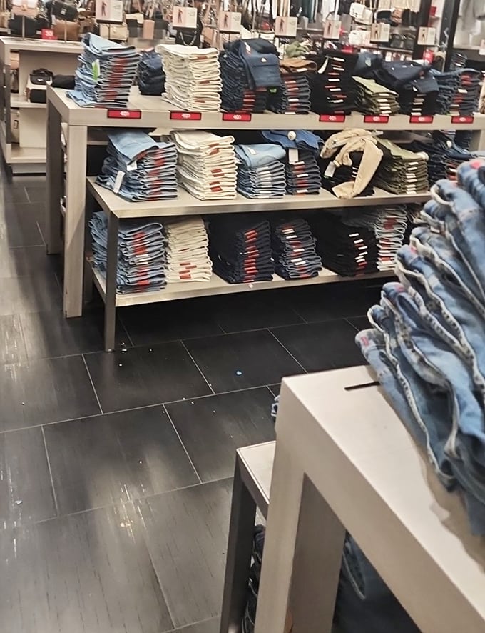 Denim paradise—stacks of jeans in every wash imaginable, from "just met the parents" dark to "lived my best life" distressed.