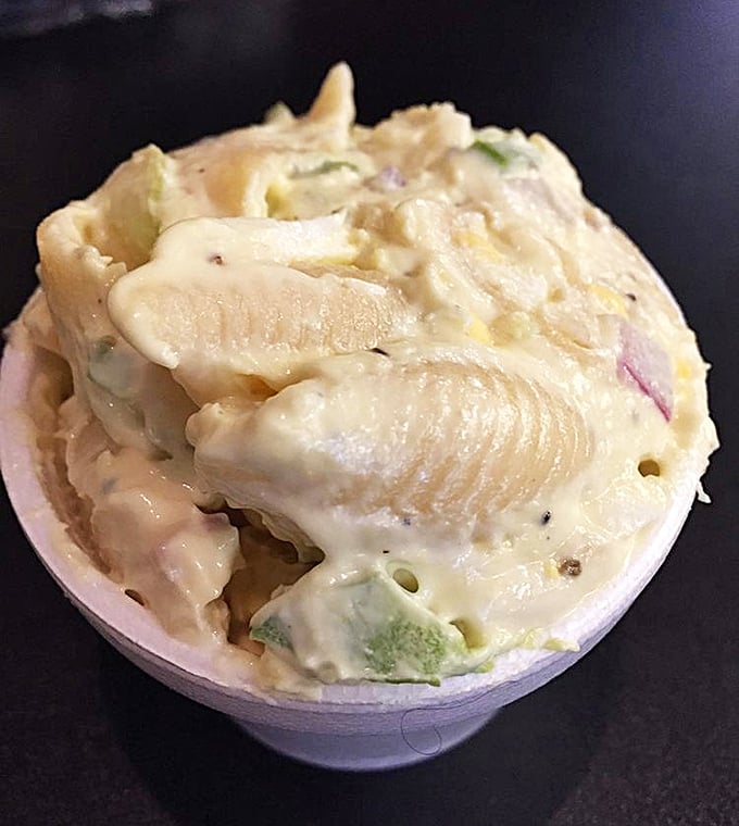 This isn't just pasta salad; it's a creamy canvas of comfort where macaroni, vegetables, and dressing perform a synchronized swimming routine for your taste buds.