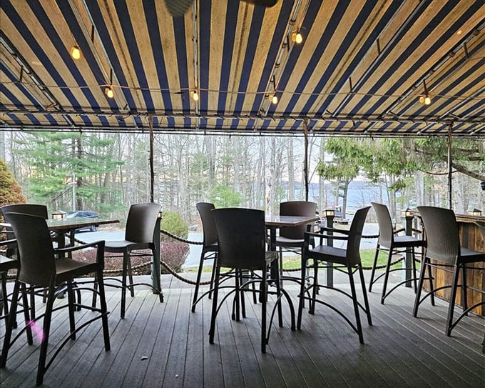 The covered patio offers al fresco dining with Pocono views—nature's television program that never needs a channel change.