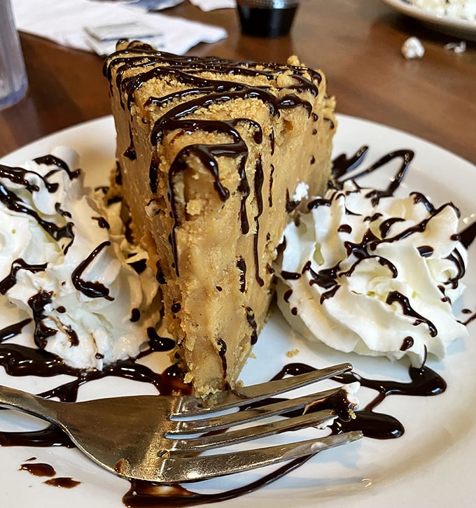 Not just peanut butter pie—this is what dessert dreams are made of. That chocolate drizzle isn't decoration; it's the exclamation point on a flavor masterpiece. 