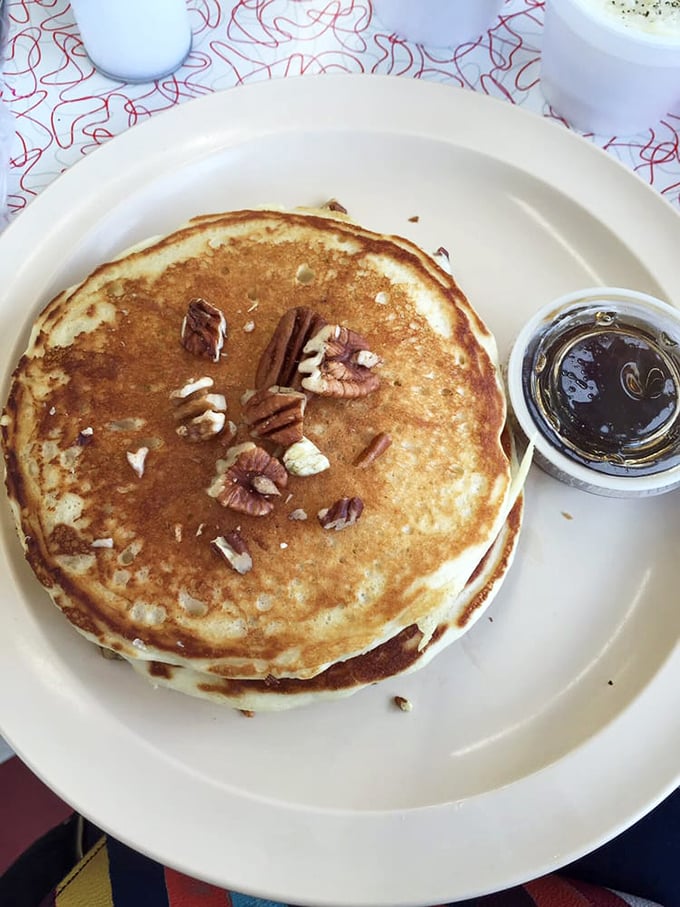 Pecan pancakes stacked high with a side of syrup – like autumn in Tennessee decided to become breakfast.