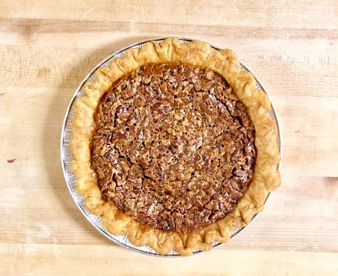 That pecan pie looks like it should be in a museum—if museums allowed visitors to devour the exhibits with a cold glass of milk.
