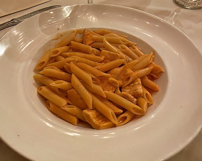 Penne in vodka sauce—pasta tubes perfectly positioned to deliver maximum sauce-to-mouth efficiency.