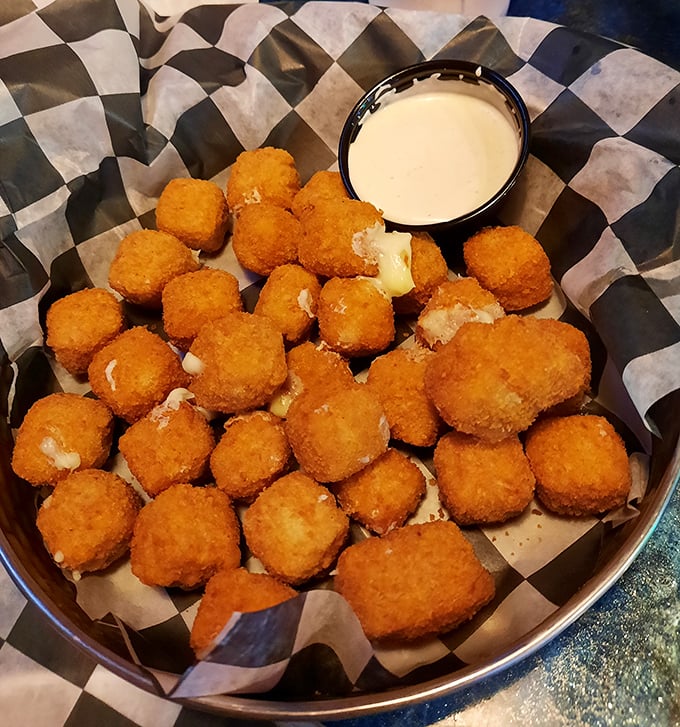 Golden-fried cheese cubes that deliver that satisfying stretch when pulled apart – the adult equivalent of finding an extra toy in your cereal box.