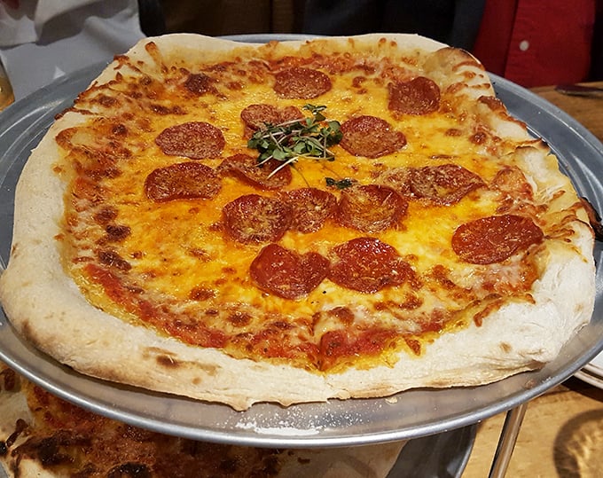 The pepperoni pizza achieves that mythical balance—a crust with character, cheese with stretch, and pepperoni that curls into flavor cups.