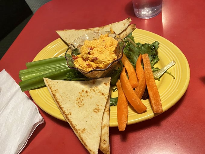 Pimiento cheese – the caviar of the South – served with fresh vegetables and triangles of pita. Simple pleasures elevated to art.