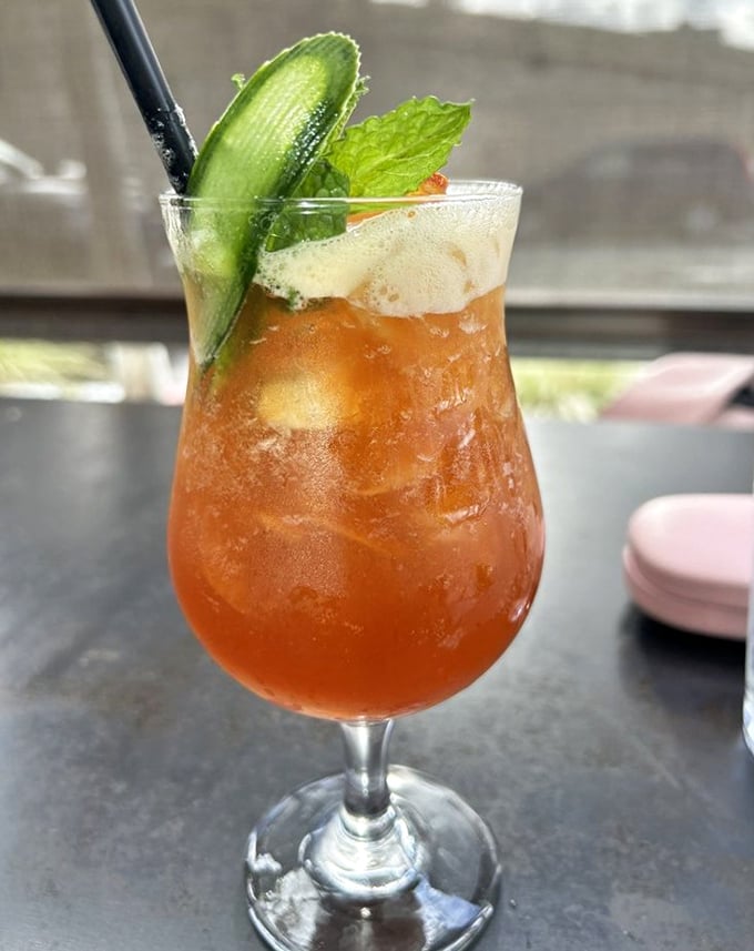 This isn't just a cocktail; it's a vacation in a glass, complete with the perfect cucumber garnish for that "I'm being healthy" alibi.