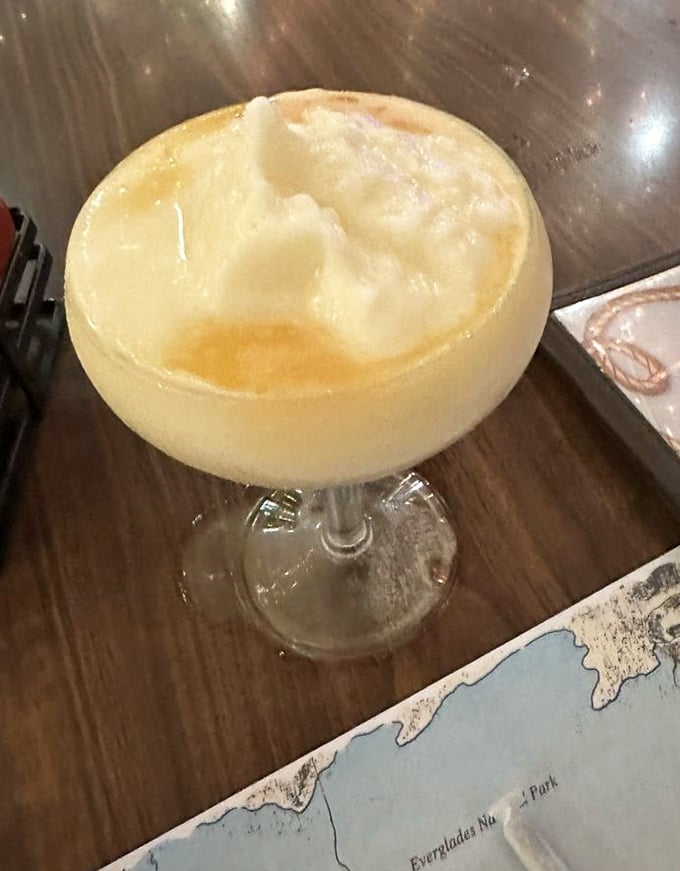 A piña colada so thick you could stand a palm tree in it—the perfect tropical brain freeze waiting to happen.