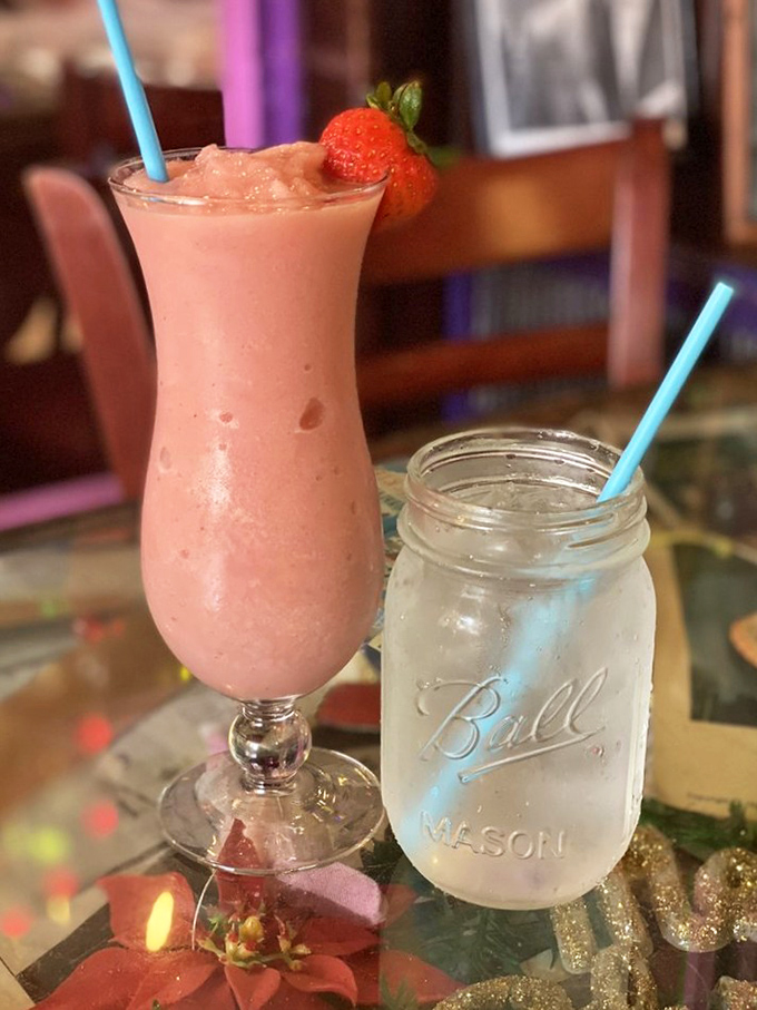 Cocktails served with a side of nostalgia—this strawberry concoction and mason jar simplicity perfectly capture the Bubble Room's charm.