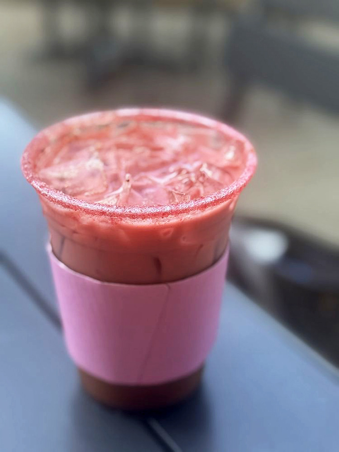 That pink latte isn't just Instagram bait—it's a creamy, dreamy concoction that proves coffee can be both serious business and seriously fun.
