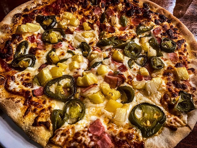 Pizza perfection with jalapeños and pineapple – the controversial combo that somehow works like peanut butter and jelly for grown-ups.