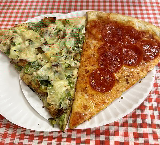 Two slices that tell different culinary stories—one a verdant landscape of vegetables, the other a pepperoni classic that never goes out of style.