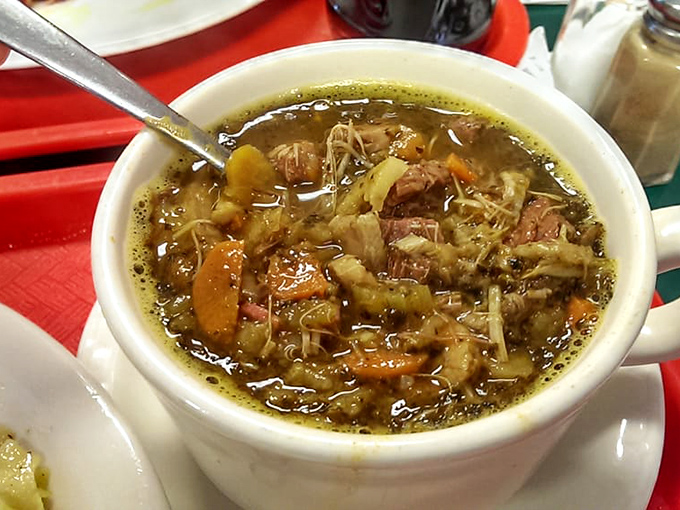 Bigos hunter's stew isn't soup—it's a hearty history lesson in a bowl, where meat, cabbage, and vegetables have simmered into something greater than their parts.