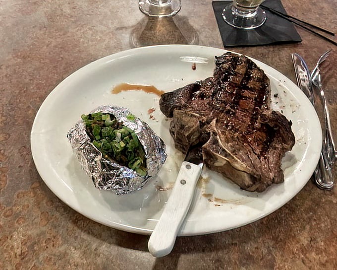 This porterhouse steak looks like it could arm-wrestle you and win – deliciously intimidating.