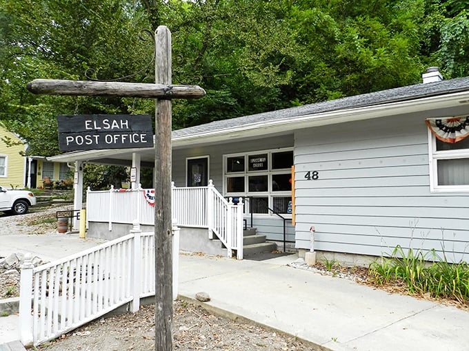 Neither snow nor rain nor gloom of night... The Elsah Post Office sign stands tall, a rustic landmark in this riverside time capsule.