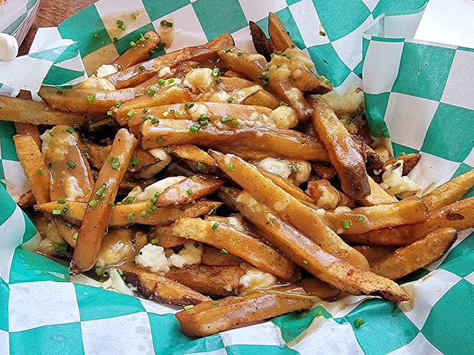 Poutine that would make Canadians weep with joy. Golden fries swimming in gravy with cheese curds playing hide and seek throughout.