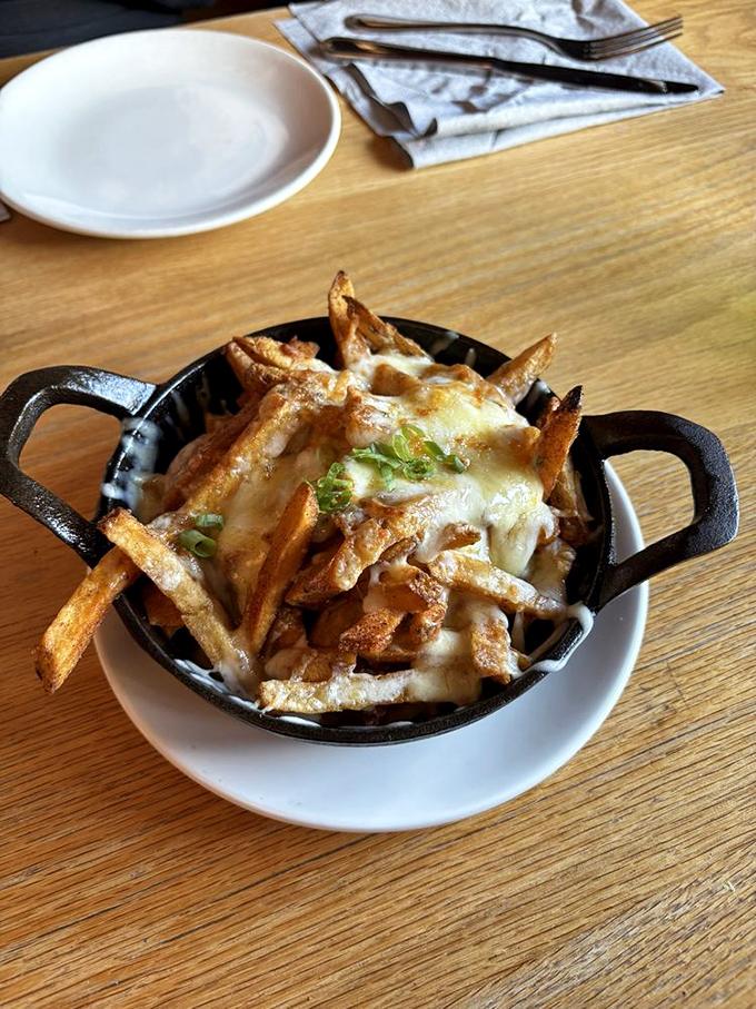 Crispy fries drowning in cheese and gravy – because some indulgences are absolutely worth every single calorie.